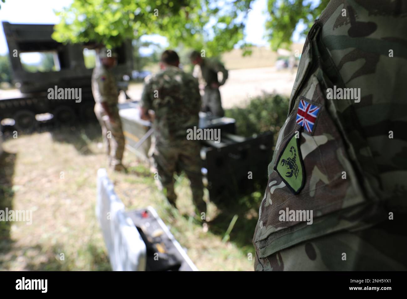 British soldiers assigned to the 26th Regiment Royal Artillery load ...