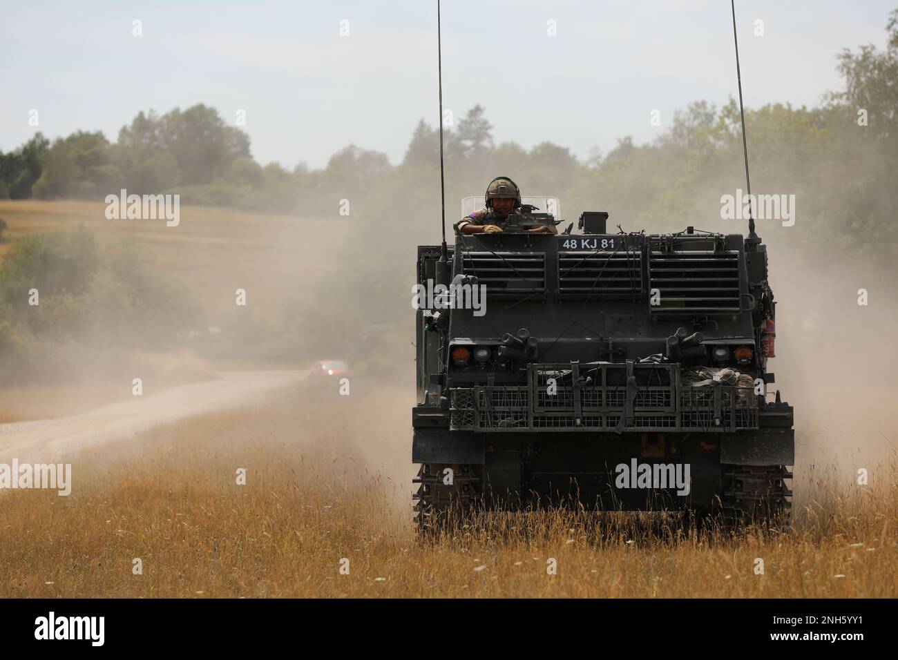 A British M270 Multiple Launch Rocket System (MLRS) crew assigned to ...