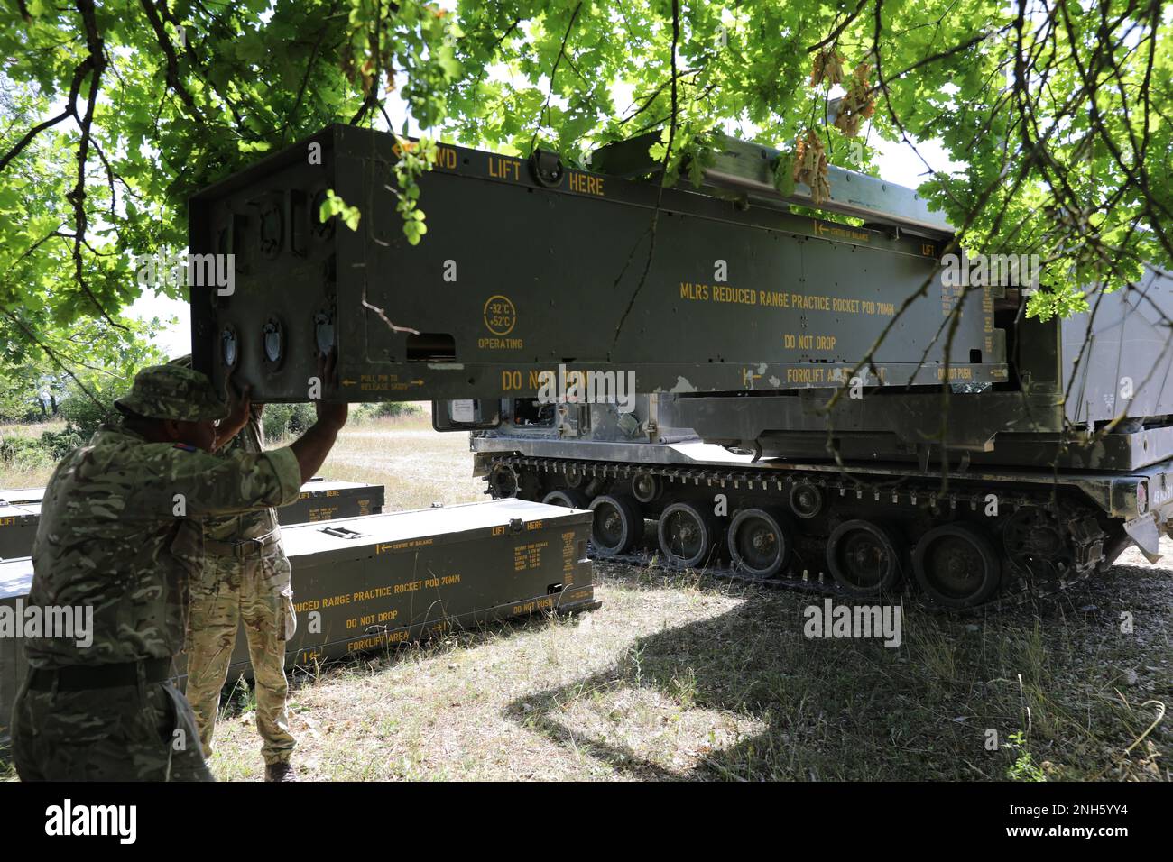 British soldiers assigned to the 26th Regiment Royal Artillery load ...