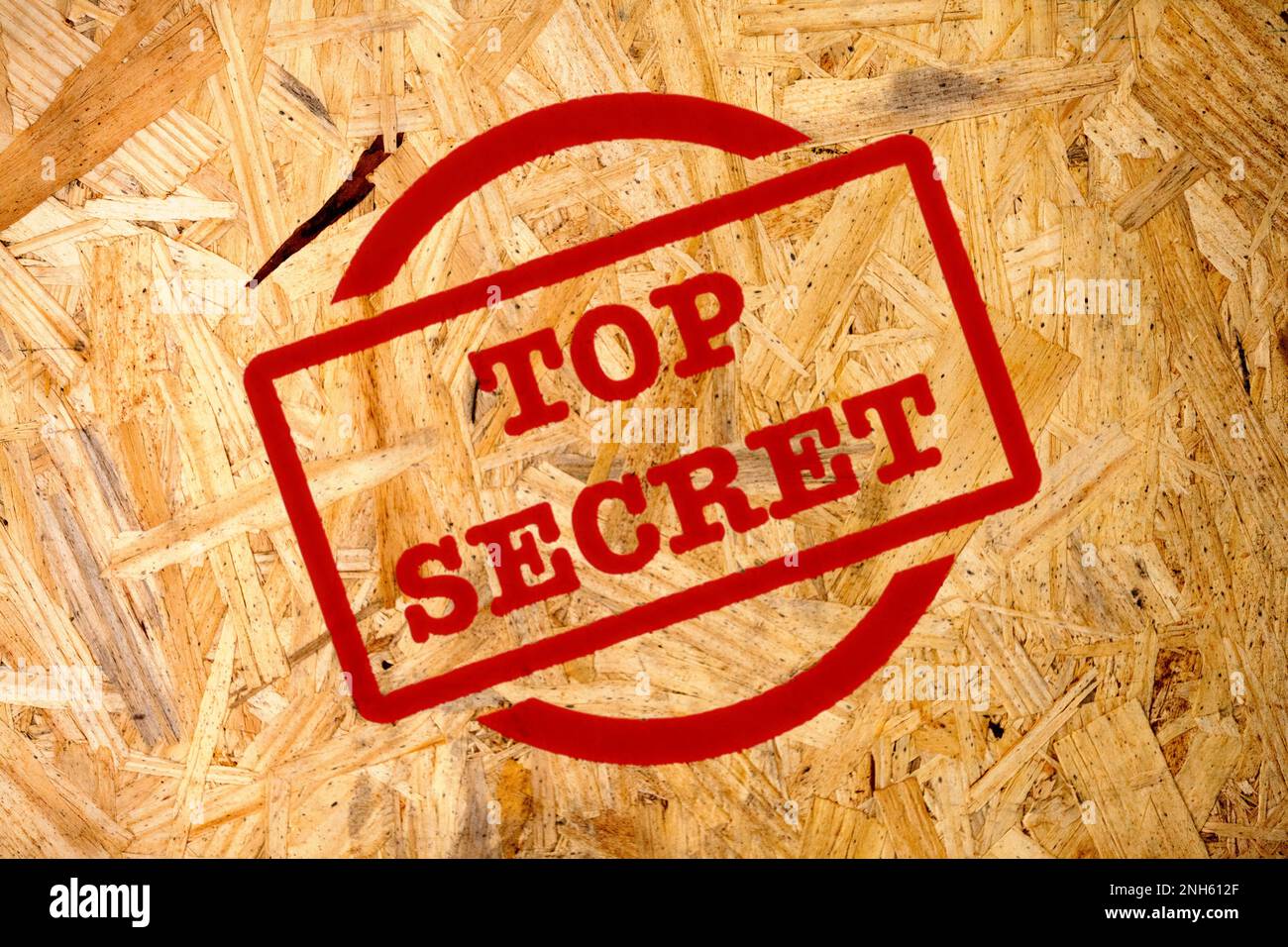 Full frame close-up on an Oriented strand board with Top secret ...