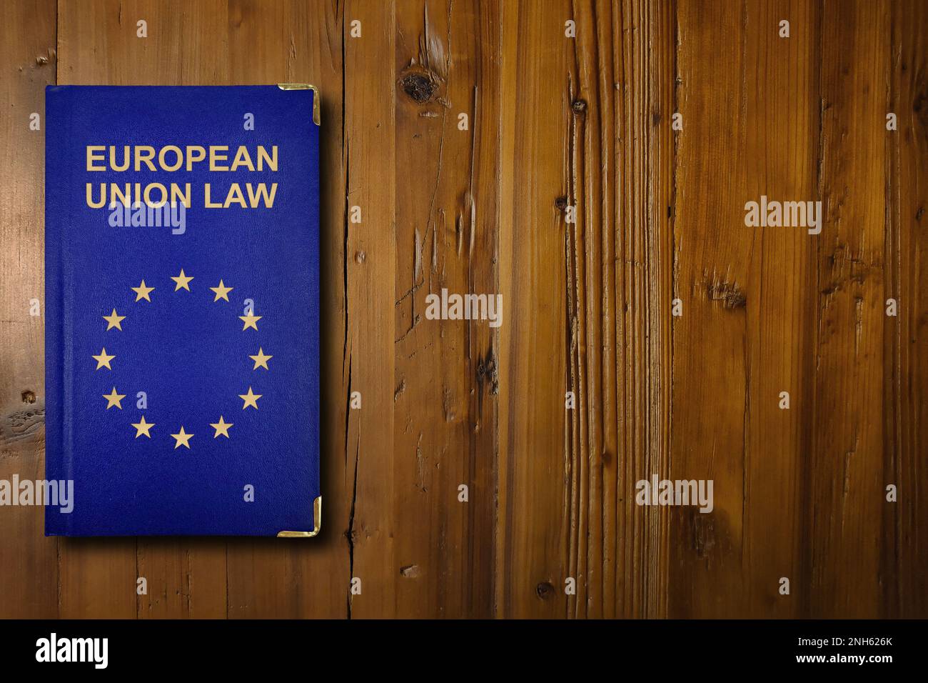Close-up on an European Union law book with a gilded EU flag symbol in ...