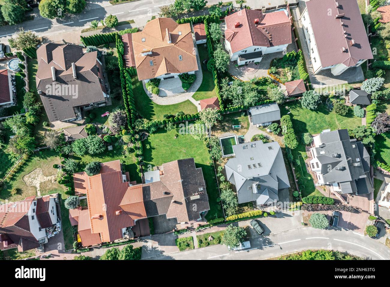 aerial view of typical contemporary private houses with tiled roof and ...