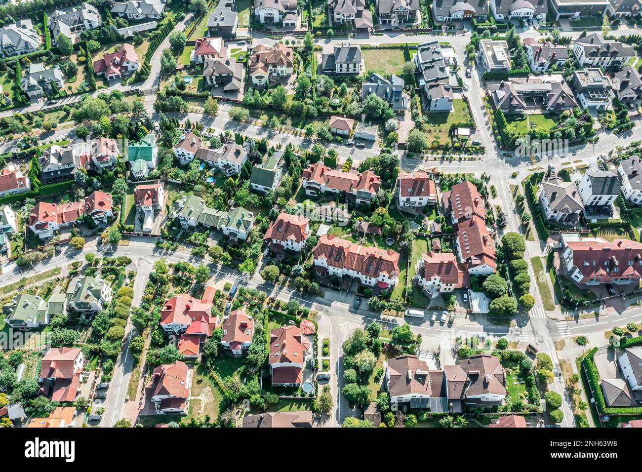 typical european housing estate on a sunny day. rows of houses, roads ...