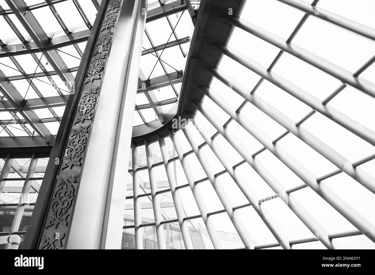 Metal column, glass roof and walls, glass architecture, view from below ...