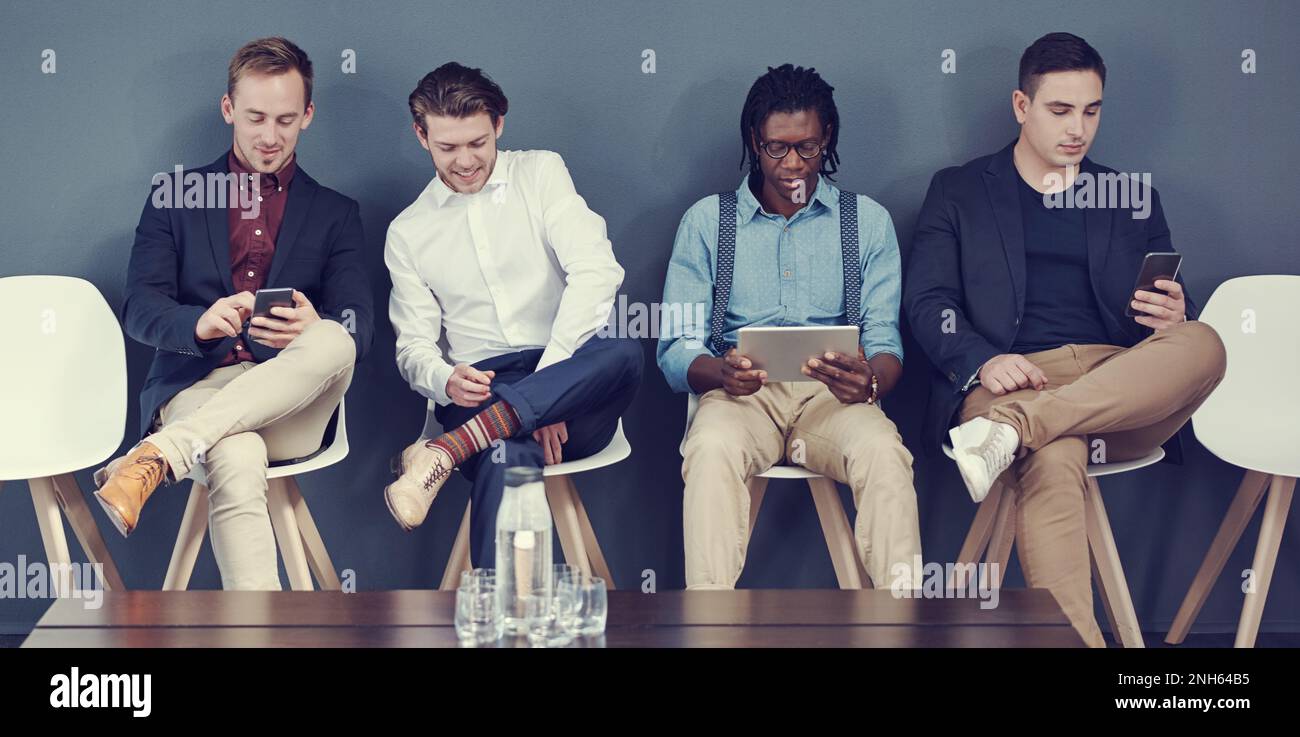 The men are ready for the interview. a group of businessmen using ...