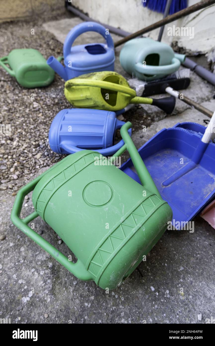 Detail of objects to water garden plants, tools Stock Photo - Alamy