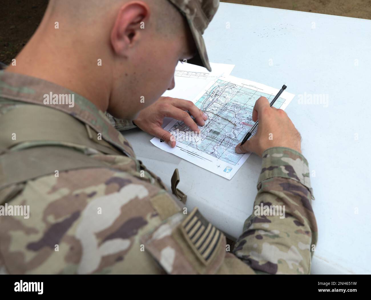 U.S. Army soldier plots his points during the land navigation event in ...