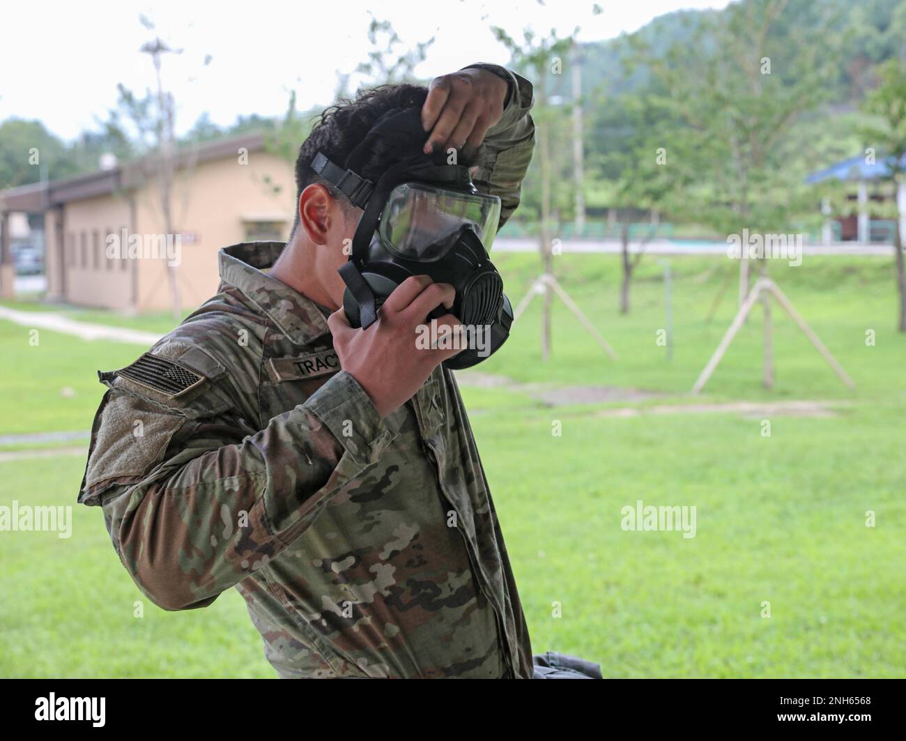 PV2 Steven Tracy, a member 8th Army's 2022 Best Squad Competition winning team, dons his MOPP 4 ...