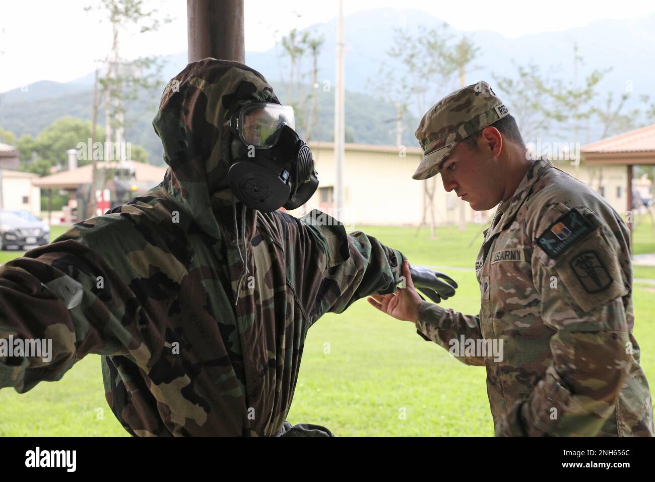 PV2 Steven Tracy, a member Eighth Army's 2022 Best Squad Competition winning team, gets his MOPP ...