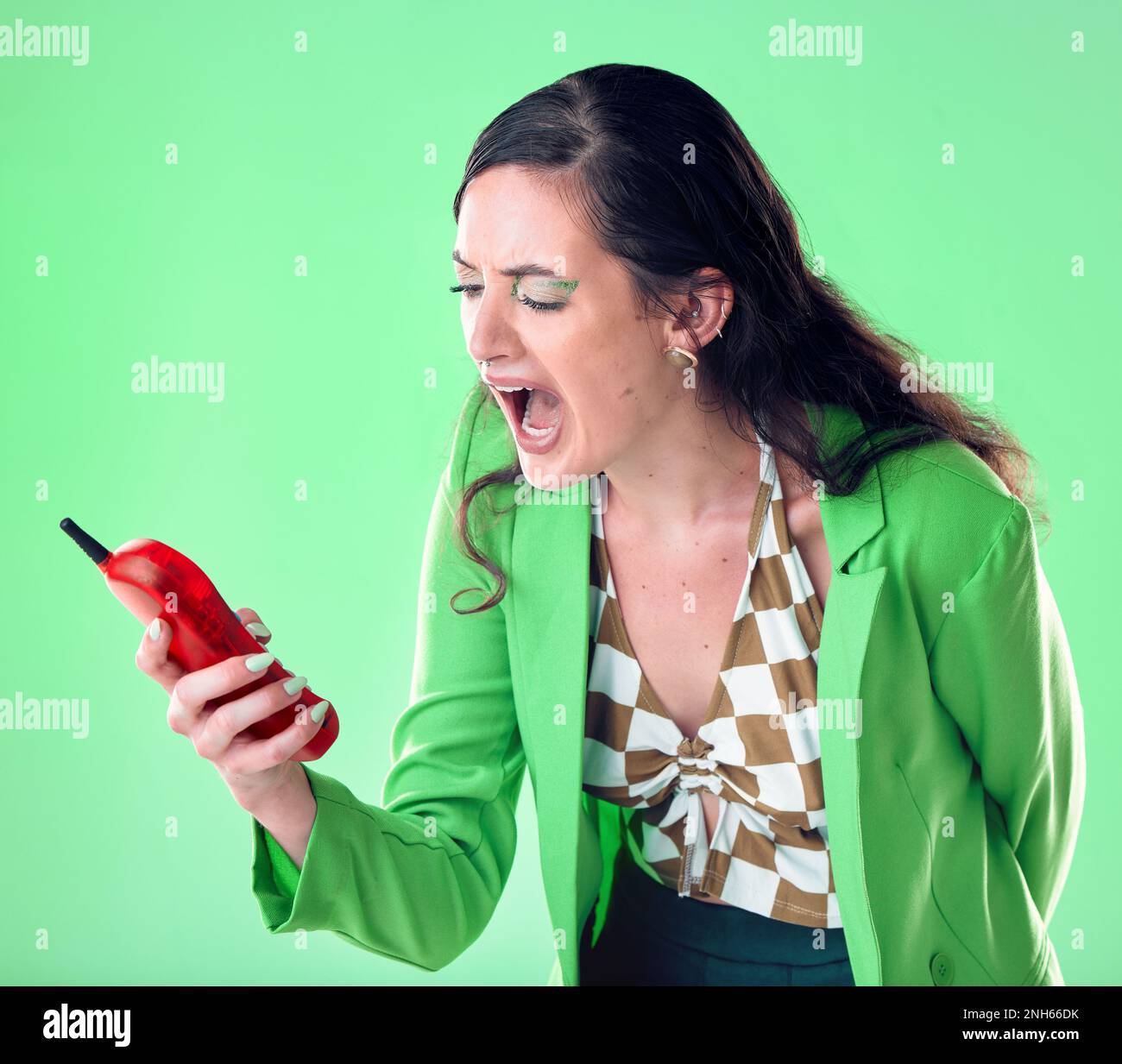 Fashion, retro phone and woman angry shouting on green background with ...