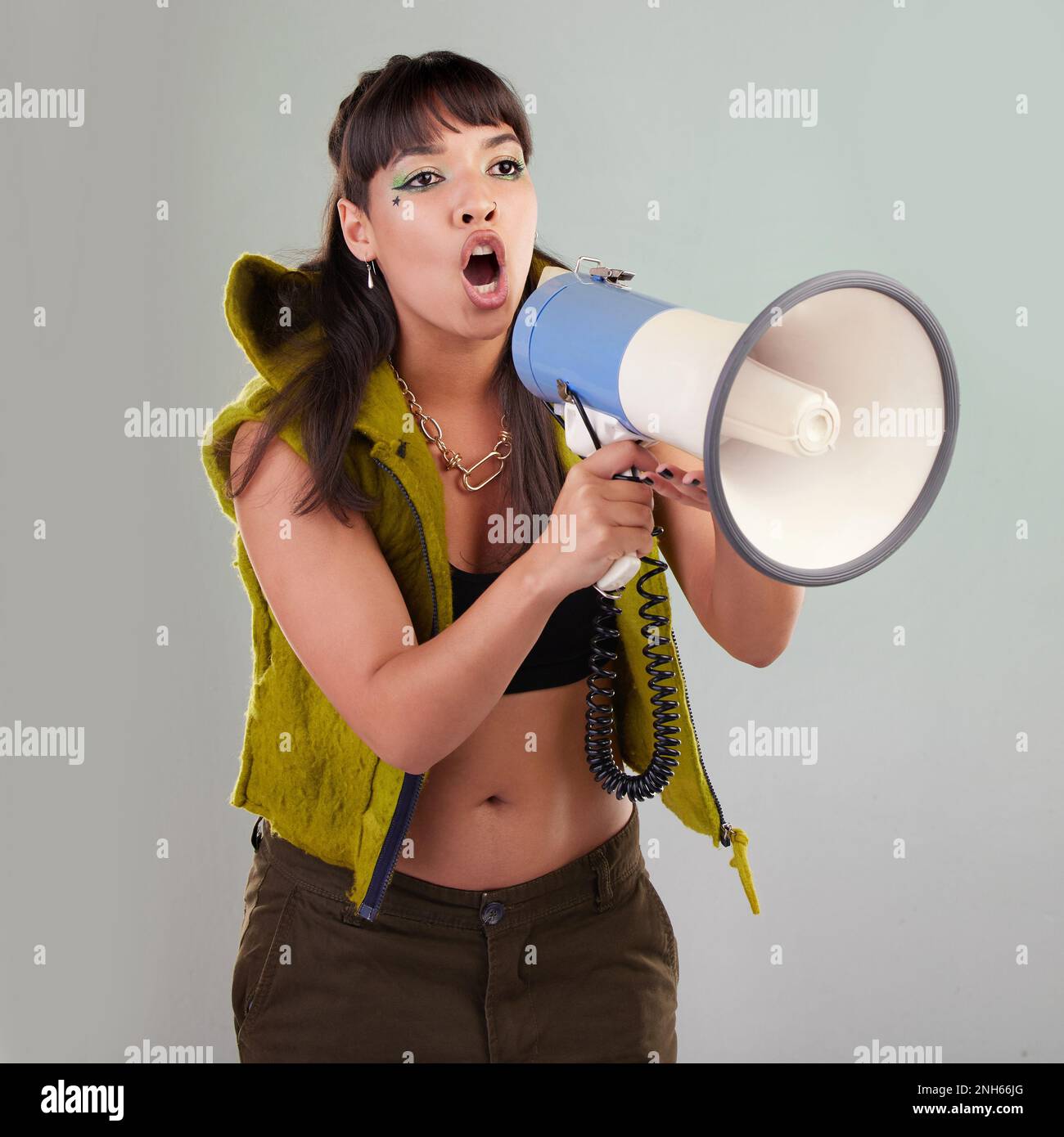 Communication, shouting and woman with a megaphone at a protest ...