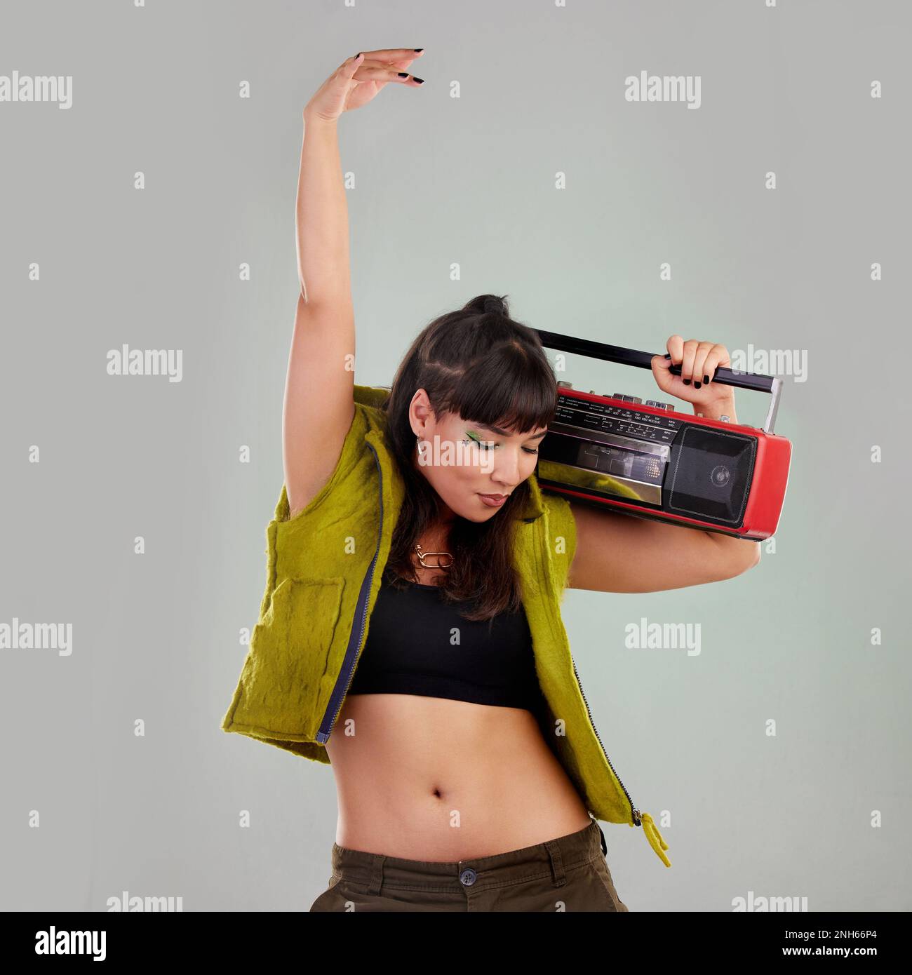 Dance, trendy and woman with a radio for music isolated on a grey ...