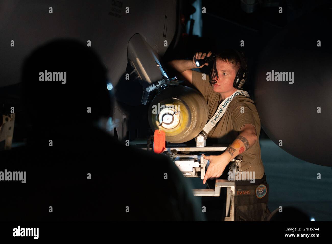 U.S. Air Force Staff Sgt. Beth Evans, a weapons load team chief ...