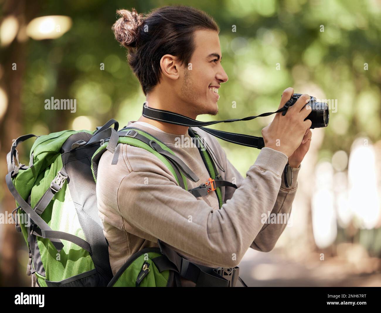 Photography man, camera and outdoor park with smile, focus or adventure ...