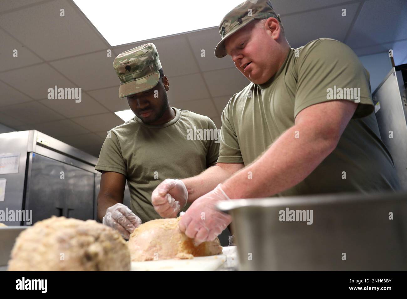 Spc. Zaquil Watson, left, and Sgt. 1st Class Matthew Frey, culinary ...
