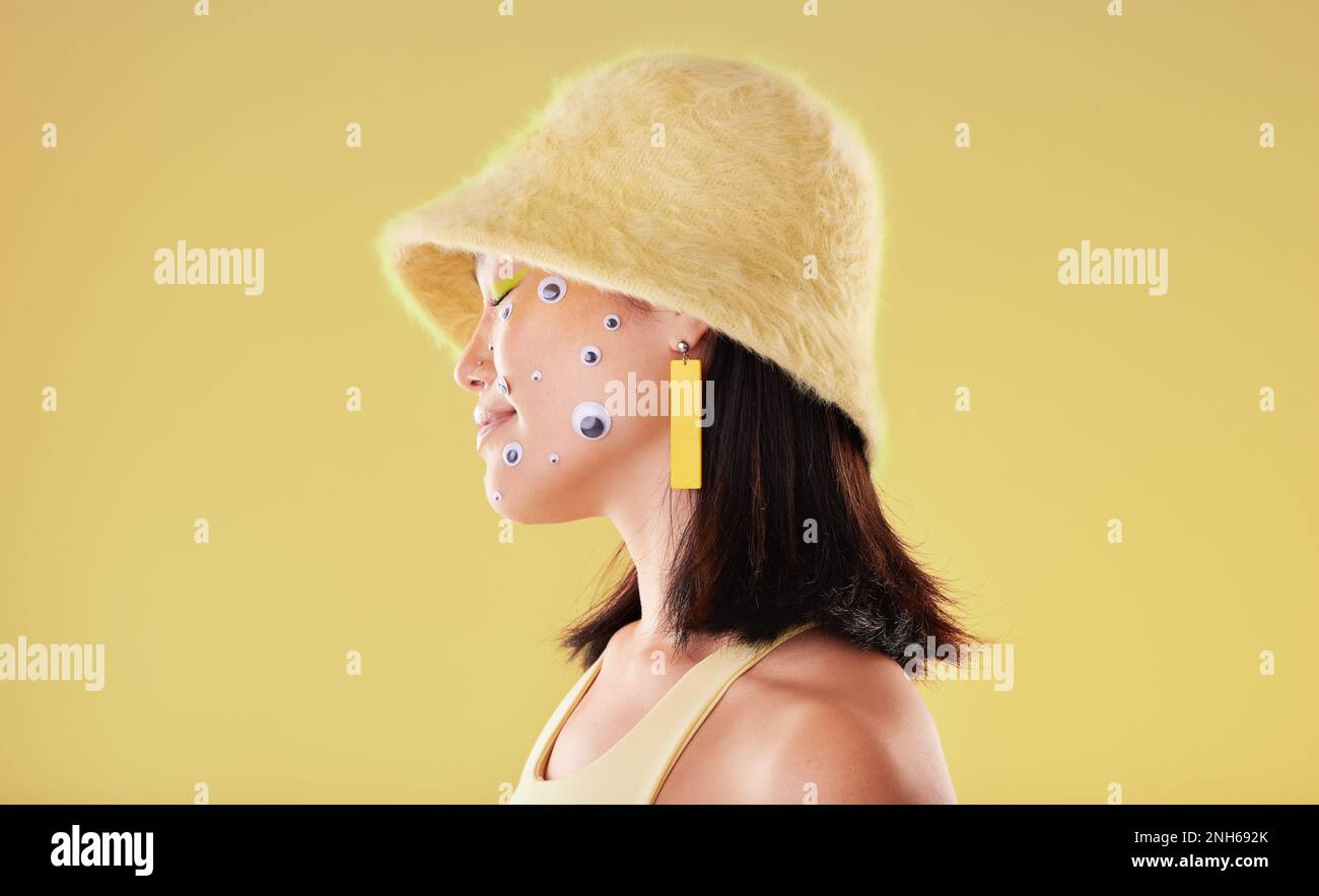 Beauty, makeup and woman with googly eyes in studio for weird, trendy ...