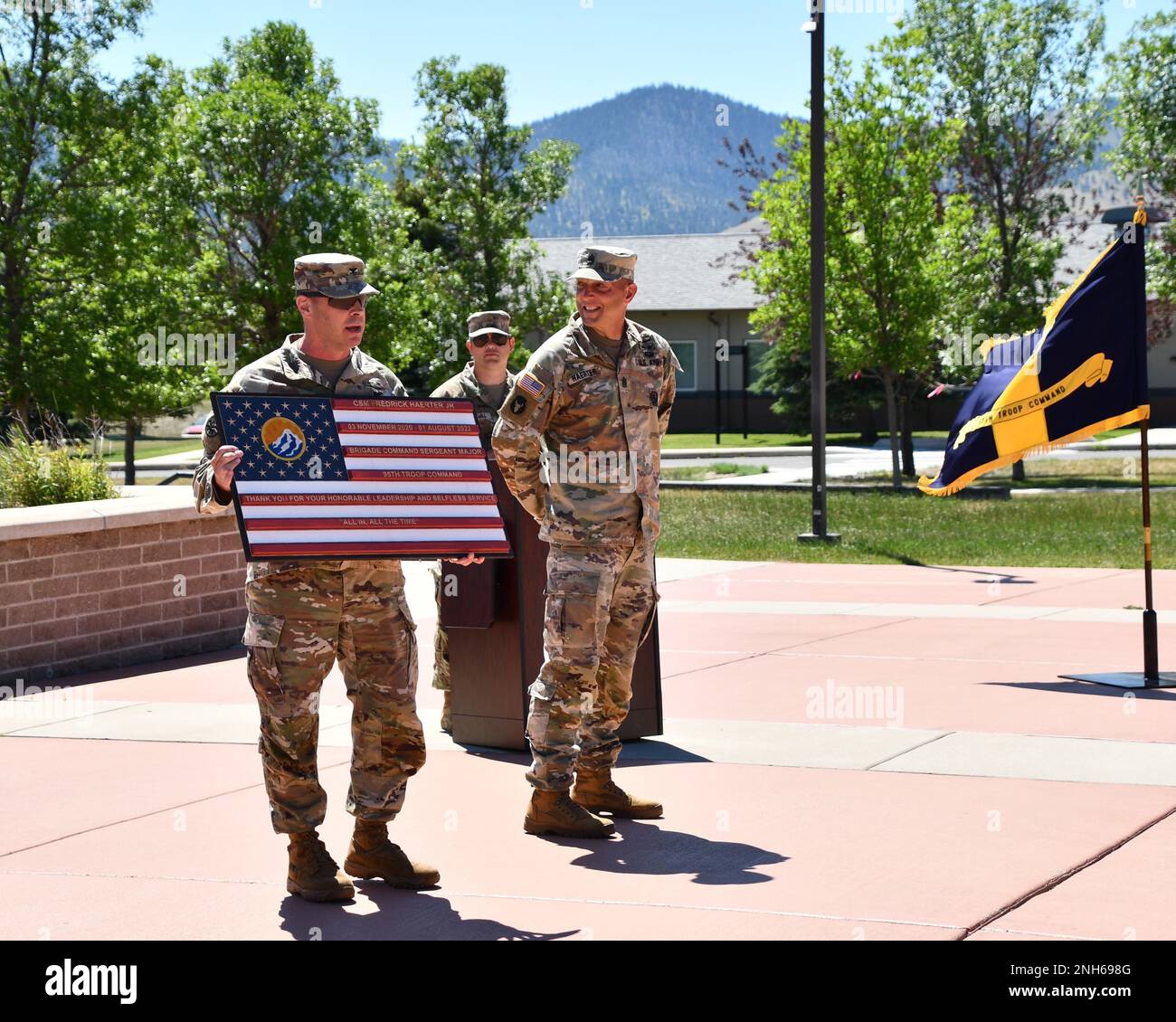 Col. Michael Beck, commander of the 95th Troop Command, presents ...