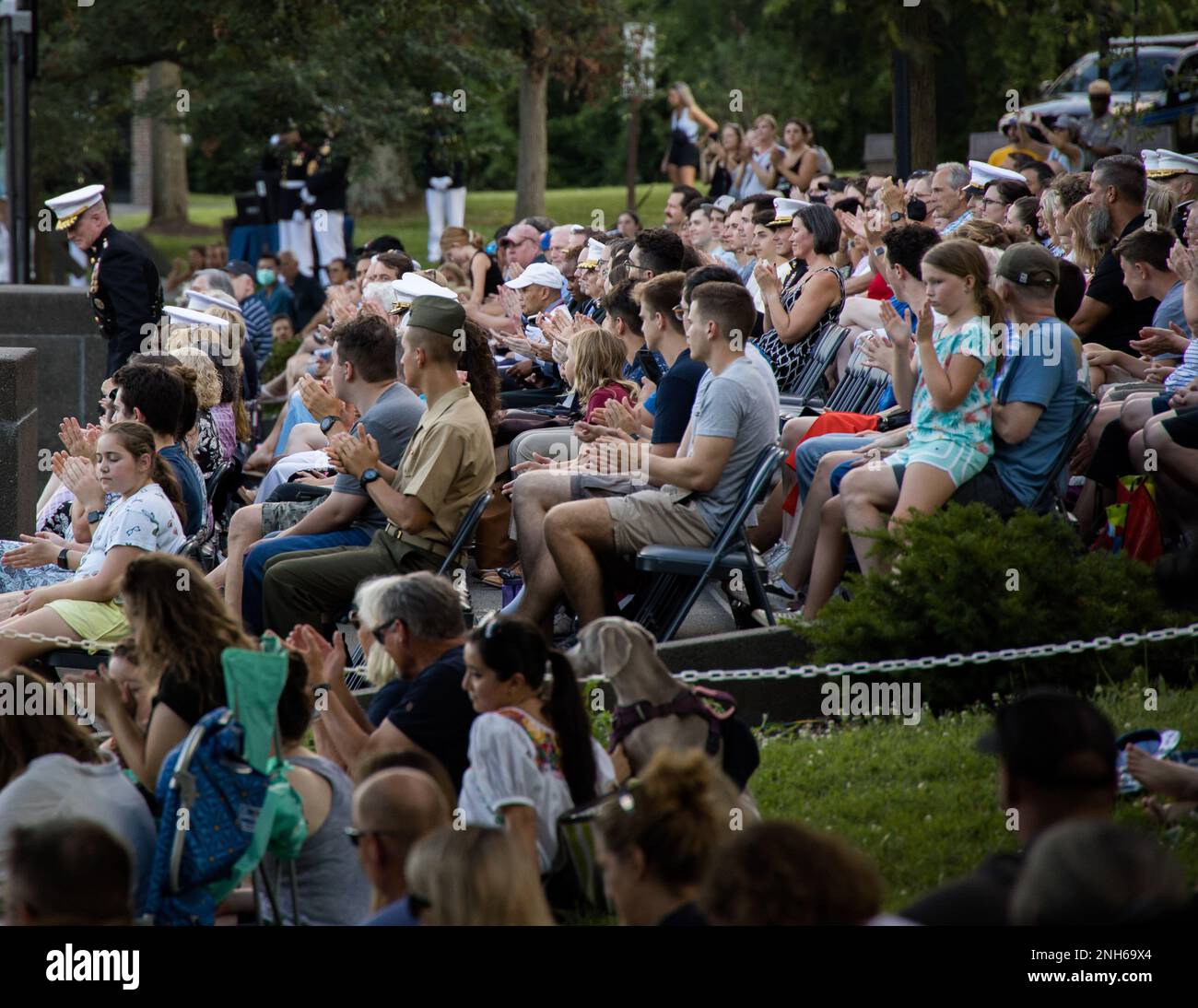 Guests cheer during a Sunset Parade at the Marine Corps War Memorial ...
