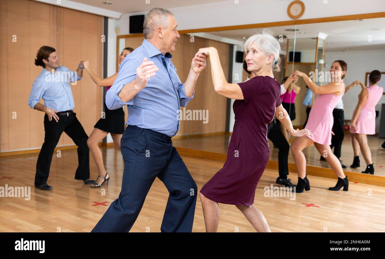 Elderly pair practicing Latino dance in dance studio Stock Photo - Alamy