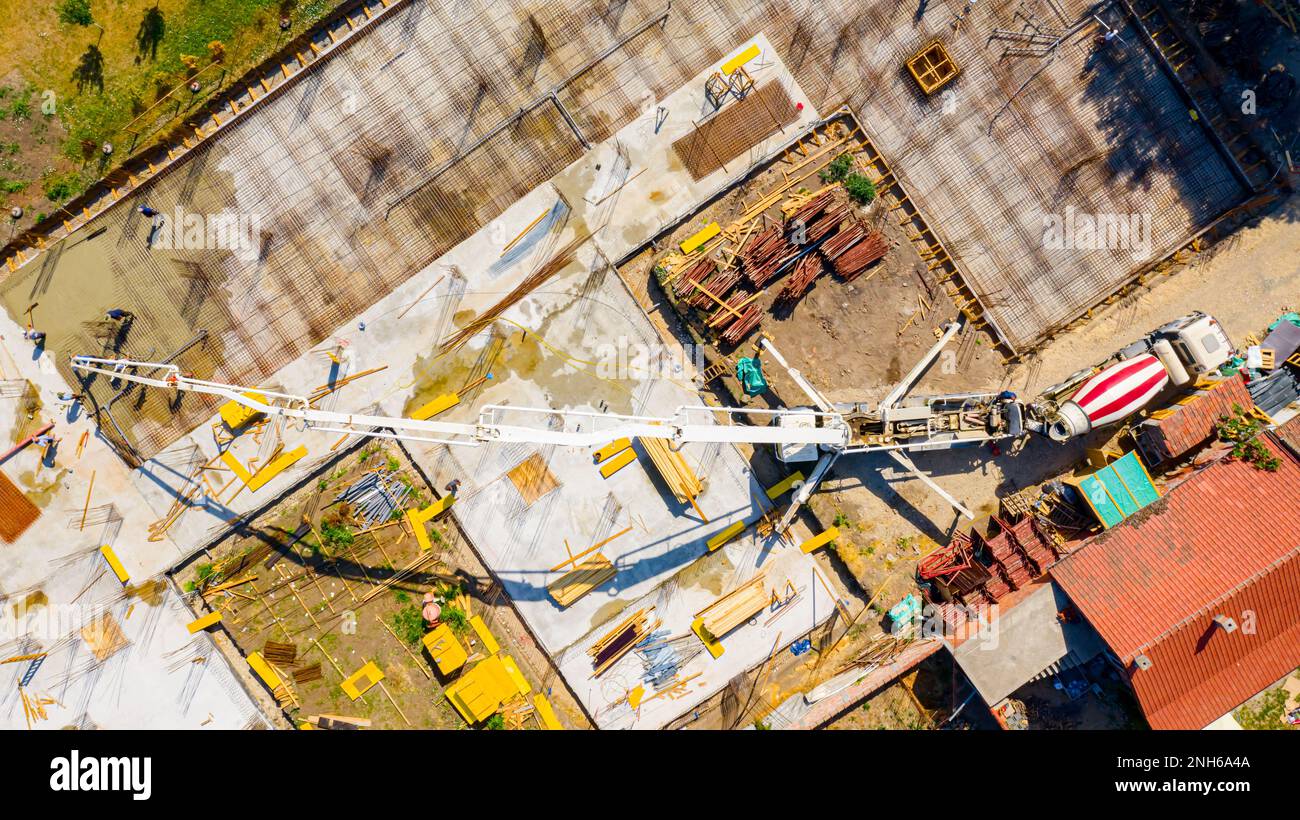 Concrete pouring crane work aerial hi-res stock photography and images ...