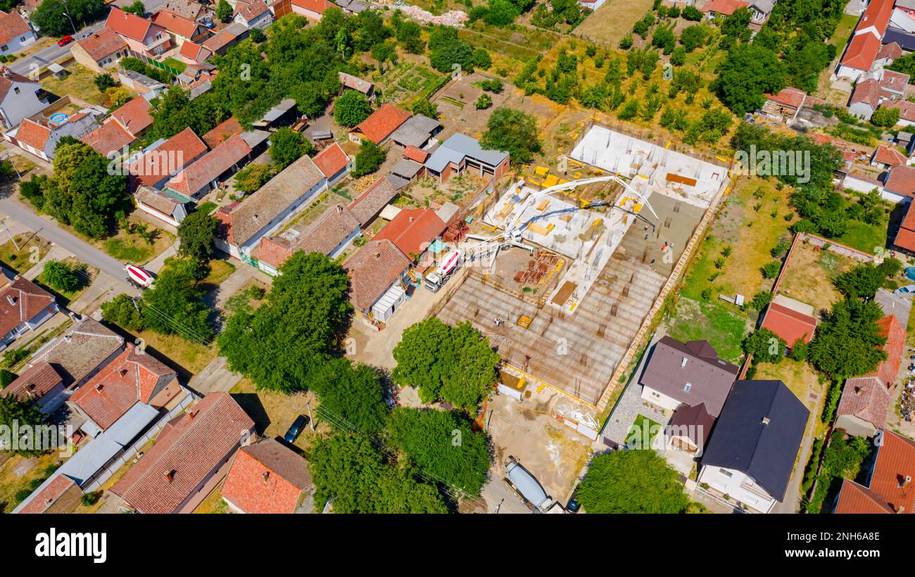Aerial view on construction site in cityscape, mixer truck pouring ...