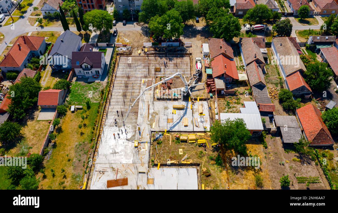 Aerial view on construction site in cityscape, mixer truck pouring ...
