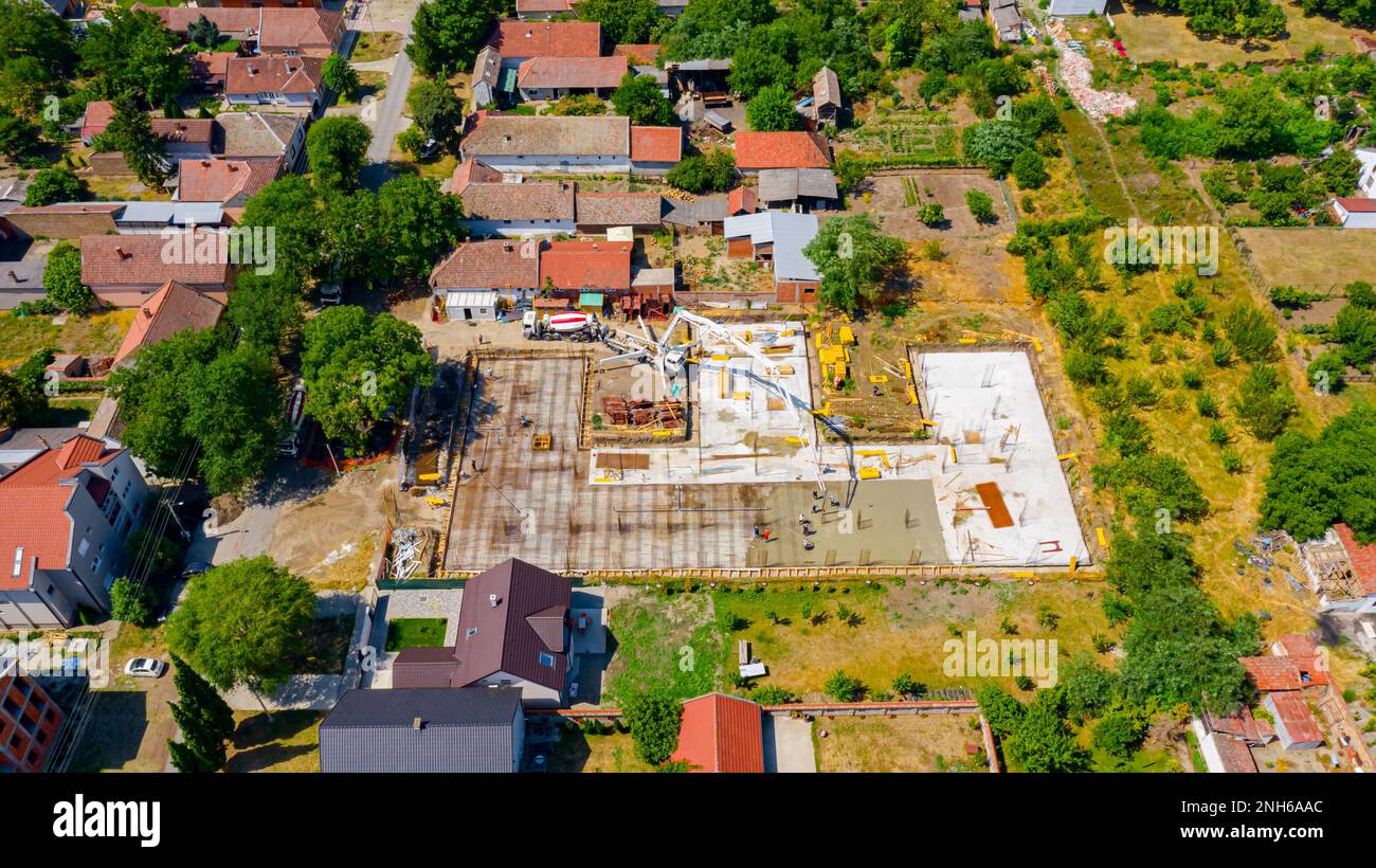 Aerial view on construction site in cityscape, mixer truck pouring ...