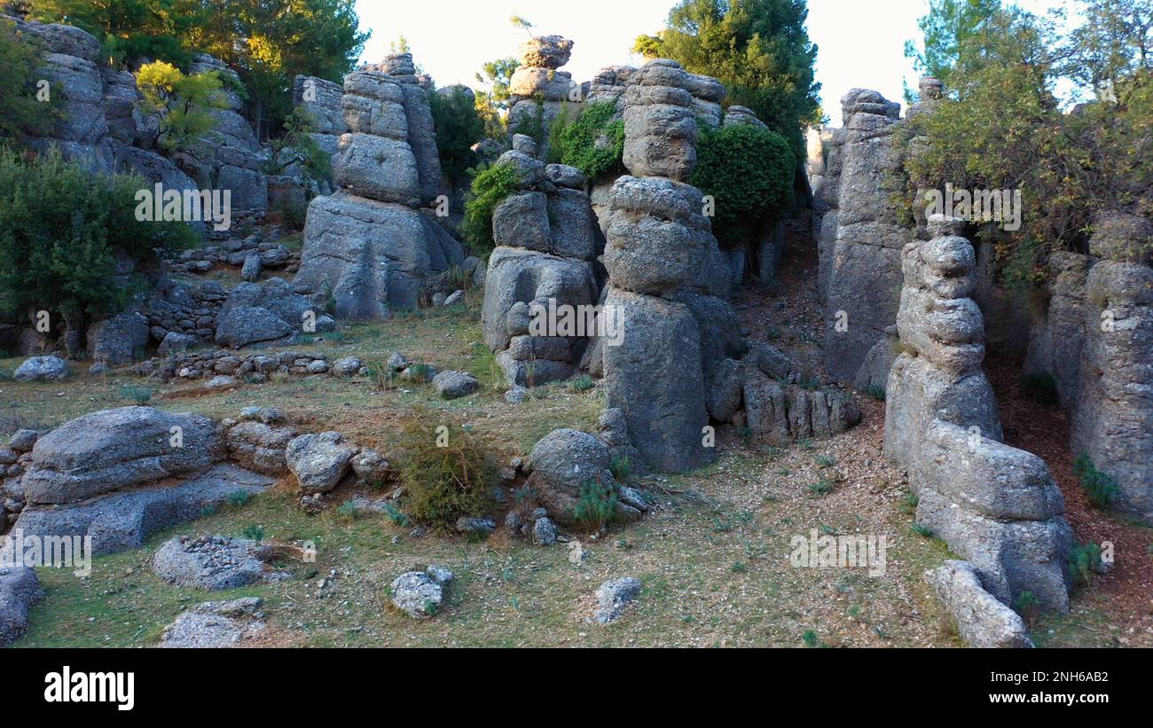 Landscape scenery with gray rock formations and evergreen trees ...