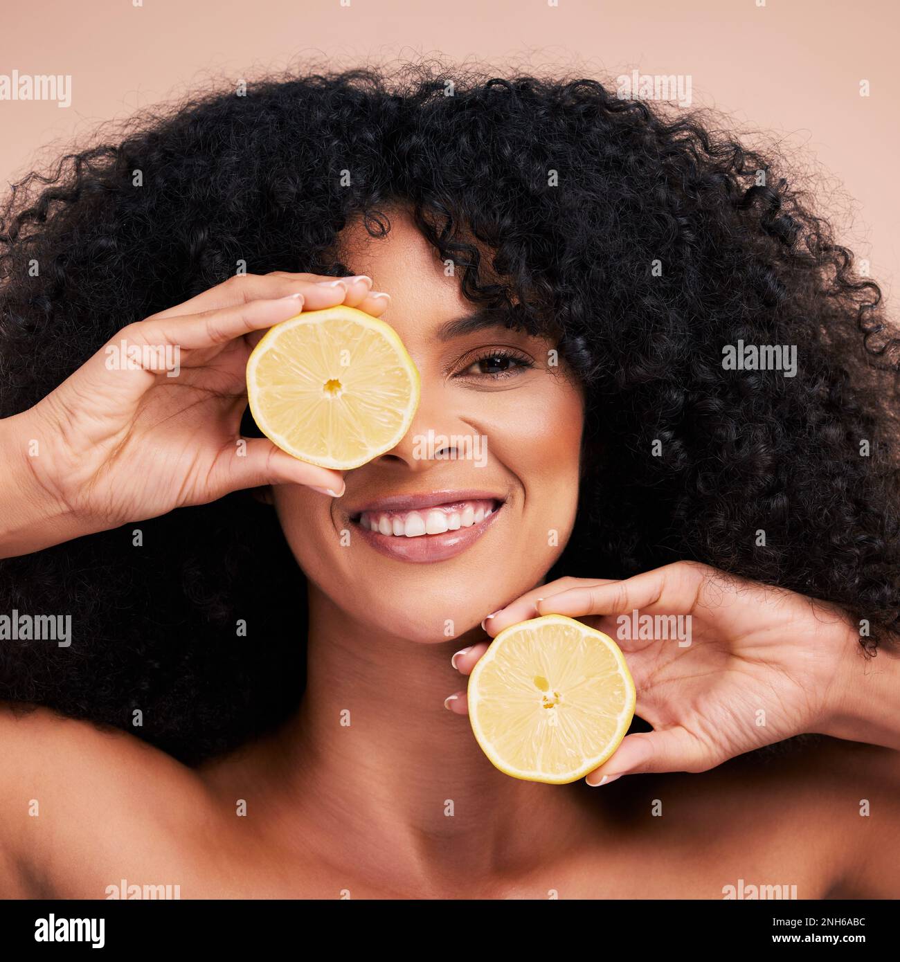 Face portrait, hair care and black woman with lemon in studio isolated ...