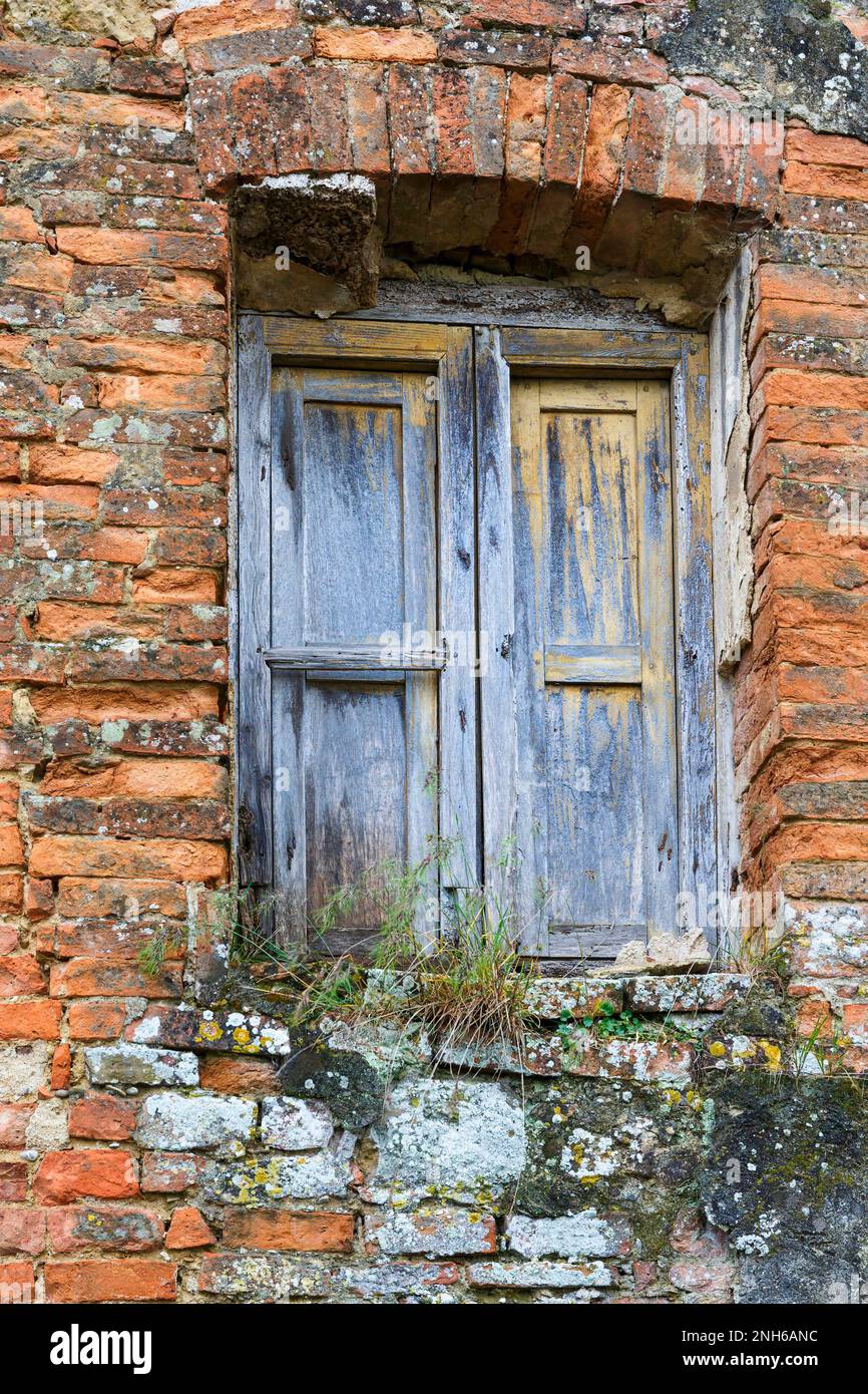 Old weathered shutters on a brick wall Stock Photo - Alamy