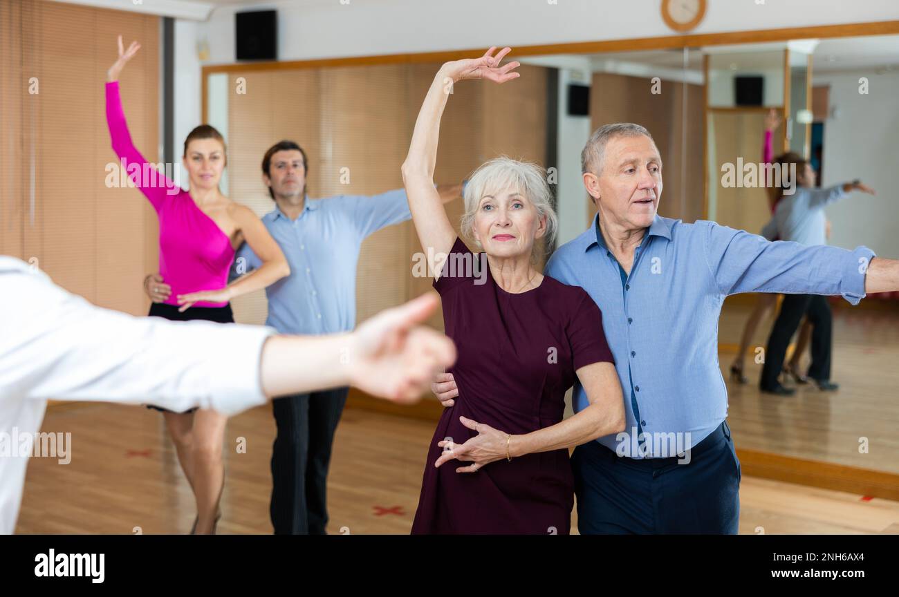 Elderly pair practicing ballroom dance in dance studio Stock Photo - Alamy