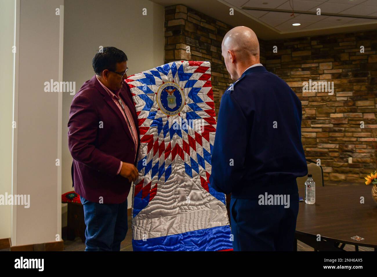 Three Affiliated Tribes Chairman Mark Fox presents a traditional quilt ...