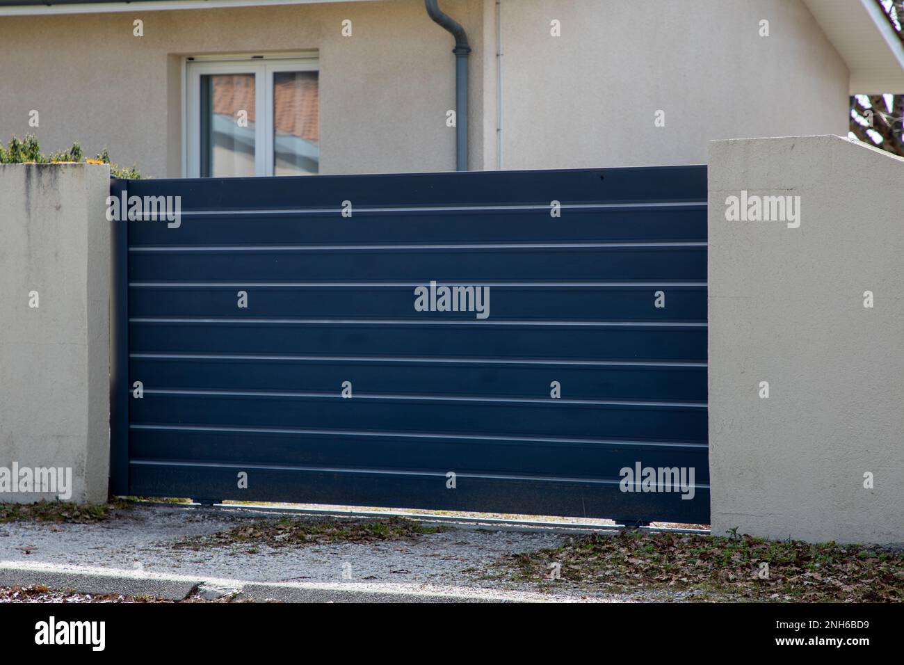 sliding portal gray high metal gate grey fence on modern suburb street ...