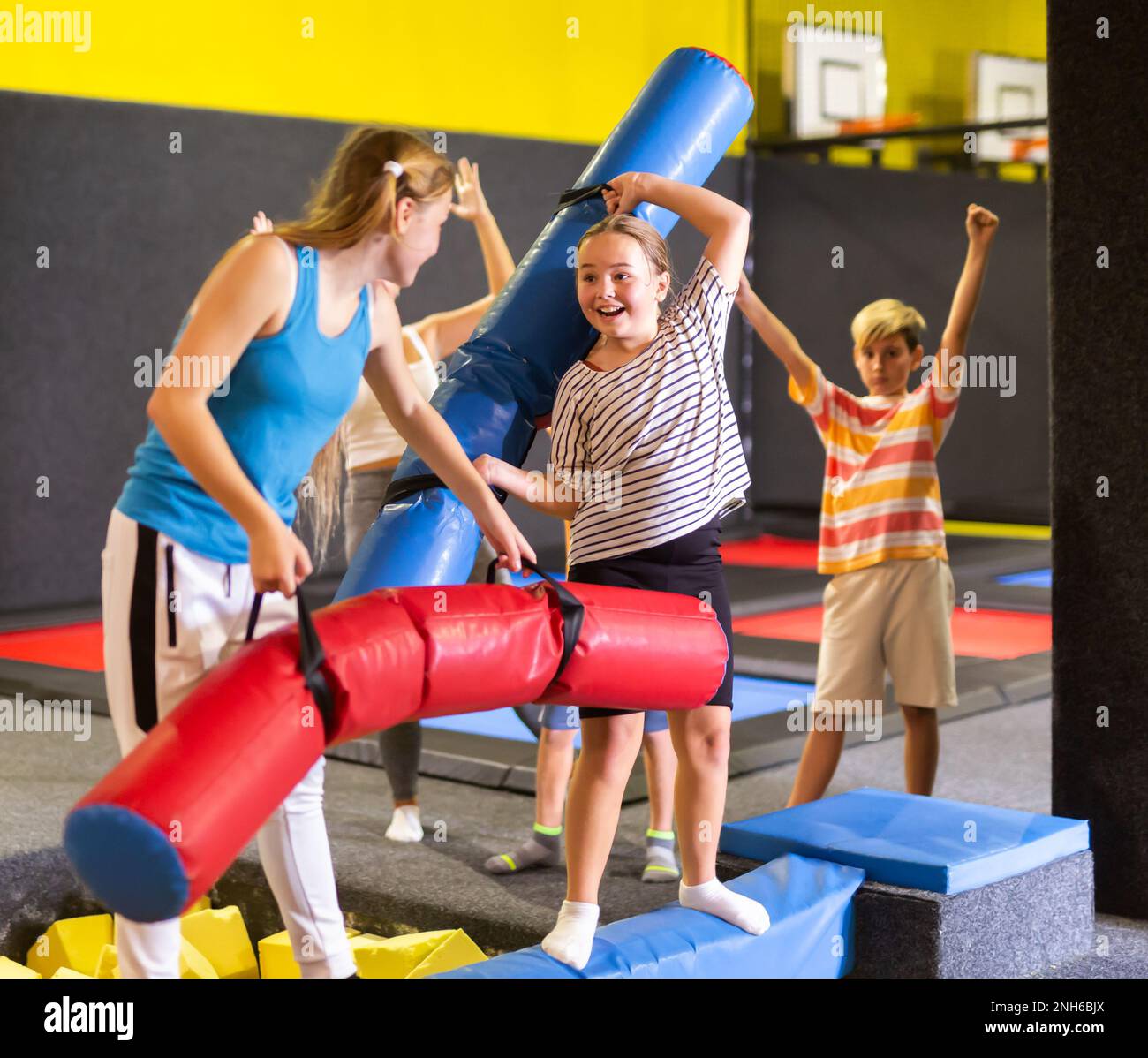 Children girls having fun and playing with inflatable sticks on the ...
