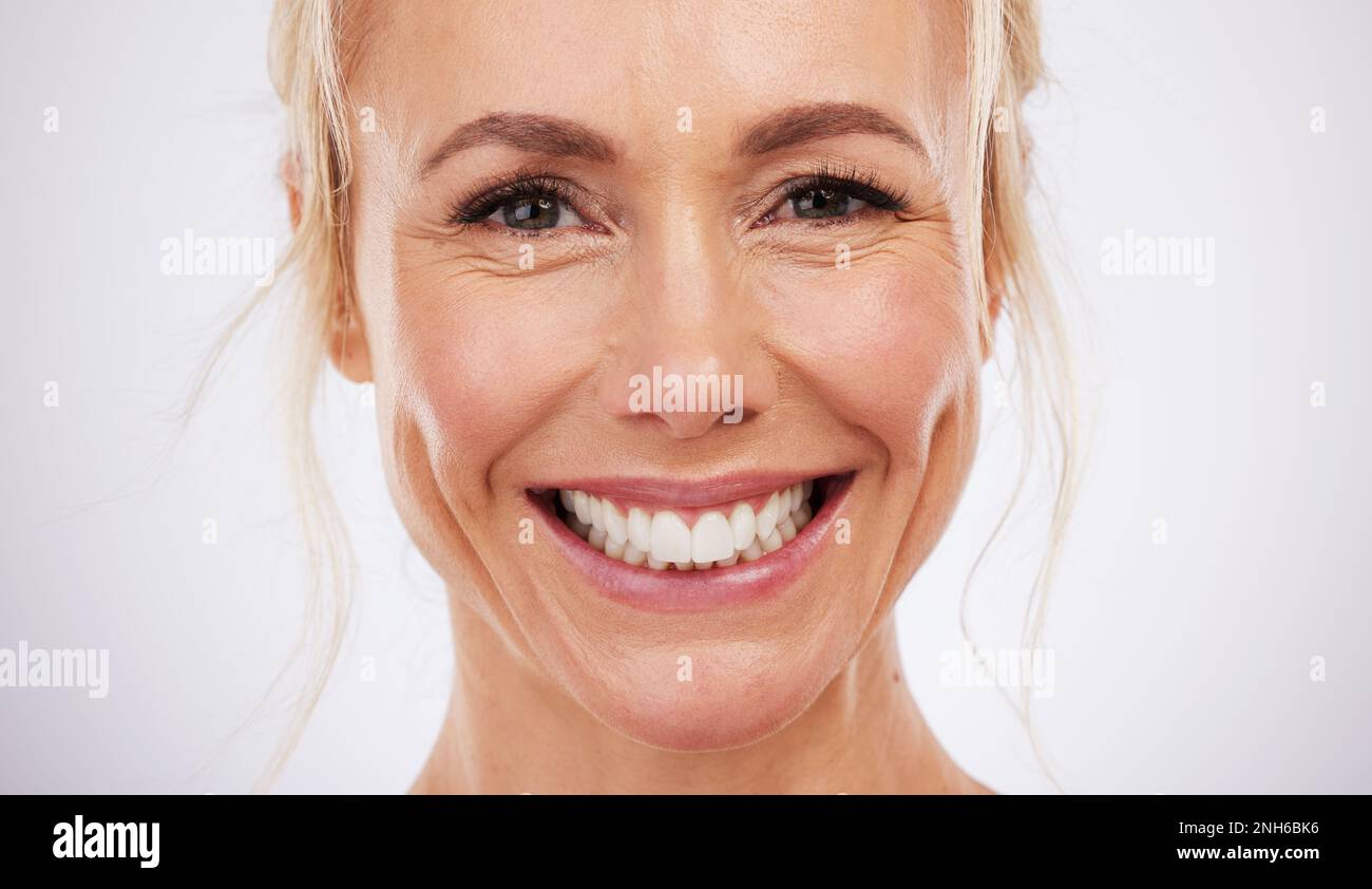 Teeth whitening, portrait and smile of woman in studio, beauty ...