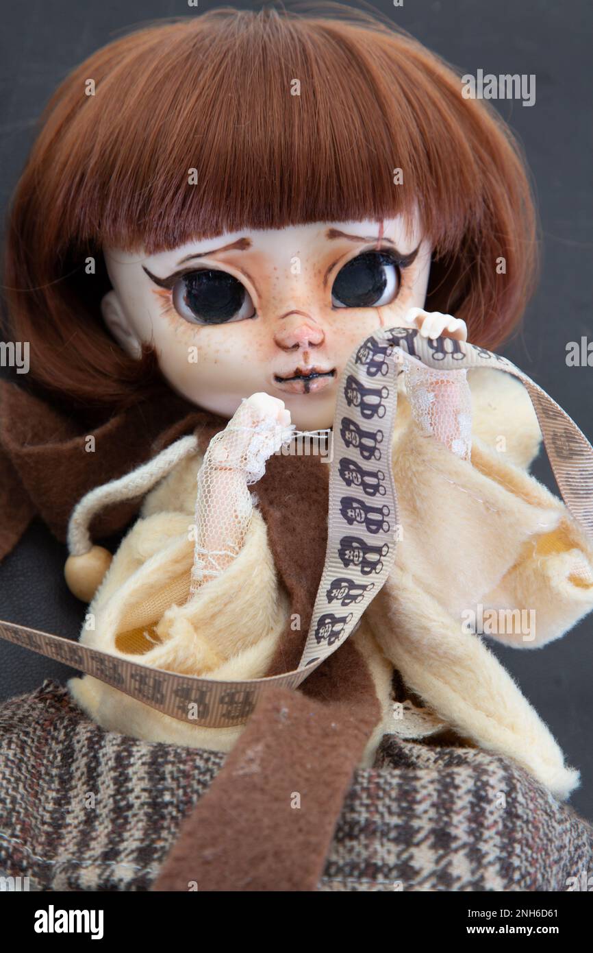 girl doll red hairs toy child game posing in grey background Stock ...