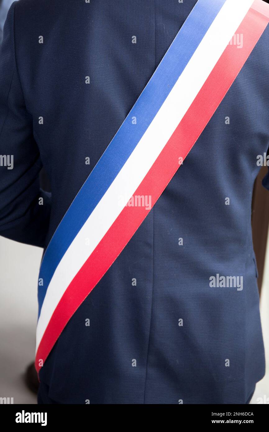 Mayor of French town with French tricolour flag mayoral sash Stock ...