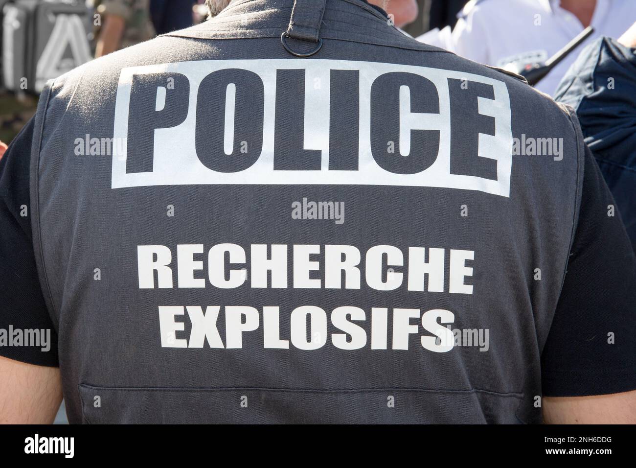 Back of policeman on guard at the time Stock Photo - Alamy
