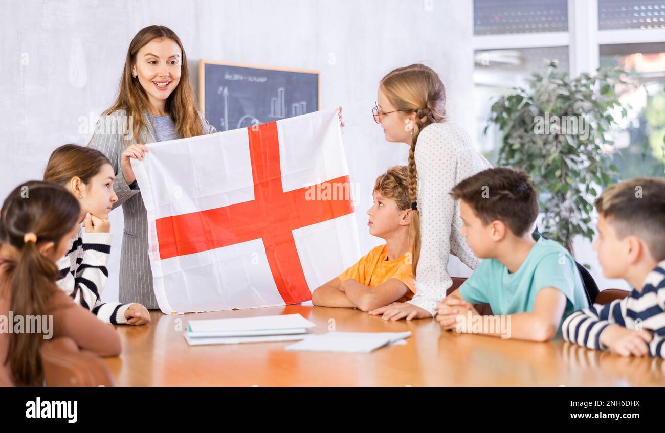 Schoolchildren listen carefully to story about the country England ...