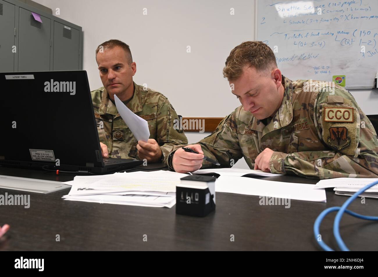 U.S. Air Force Master Sgt. Cory Selfies (left), a contract specialist ...