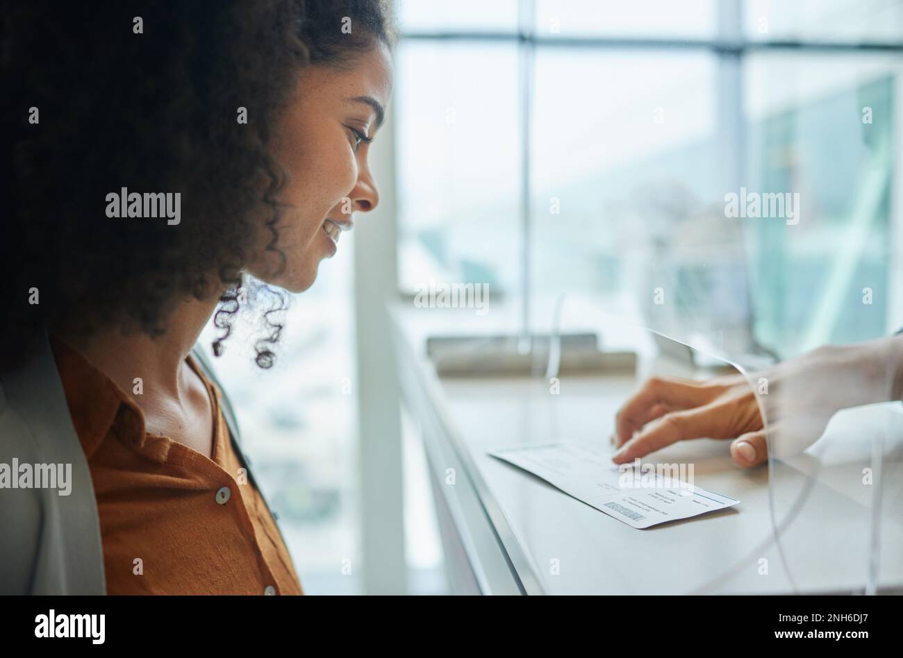 Ticket, glass window and black woman at airport or theatre with paper ...