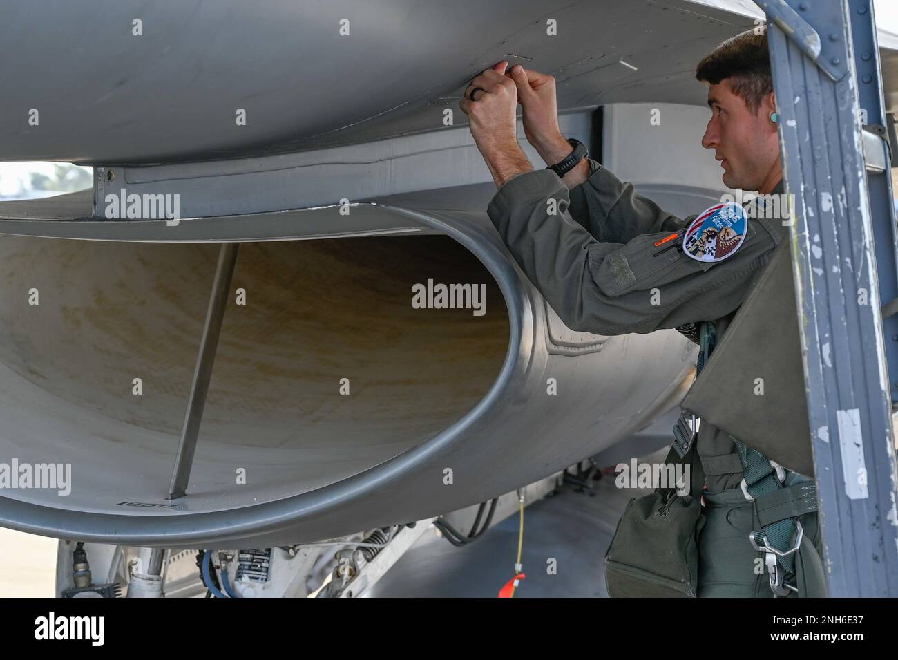 1st Lt. Nathan Thomas, an active-duty F-16 student pilot, prepares his ...