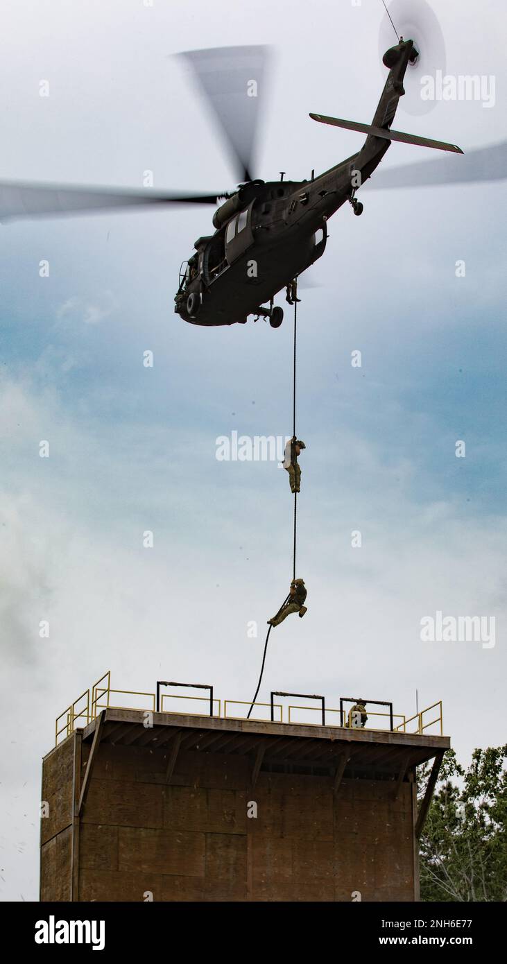 U.S. Army Special Forces Soldiers conduct fast rope insertion training ...