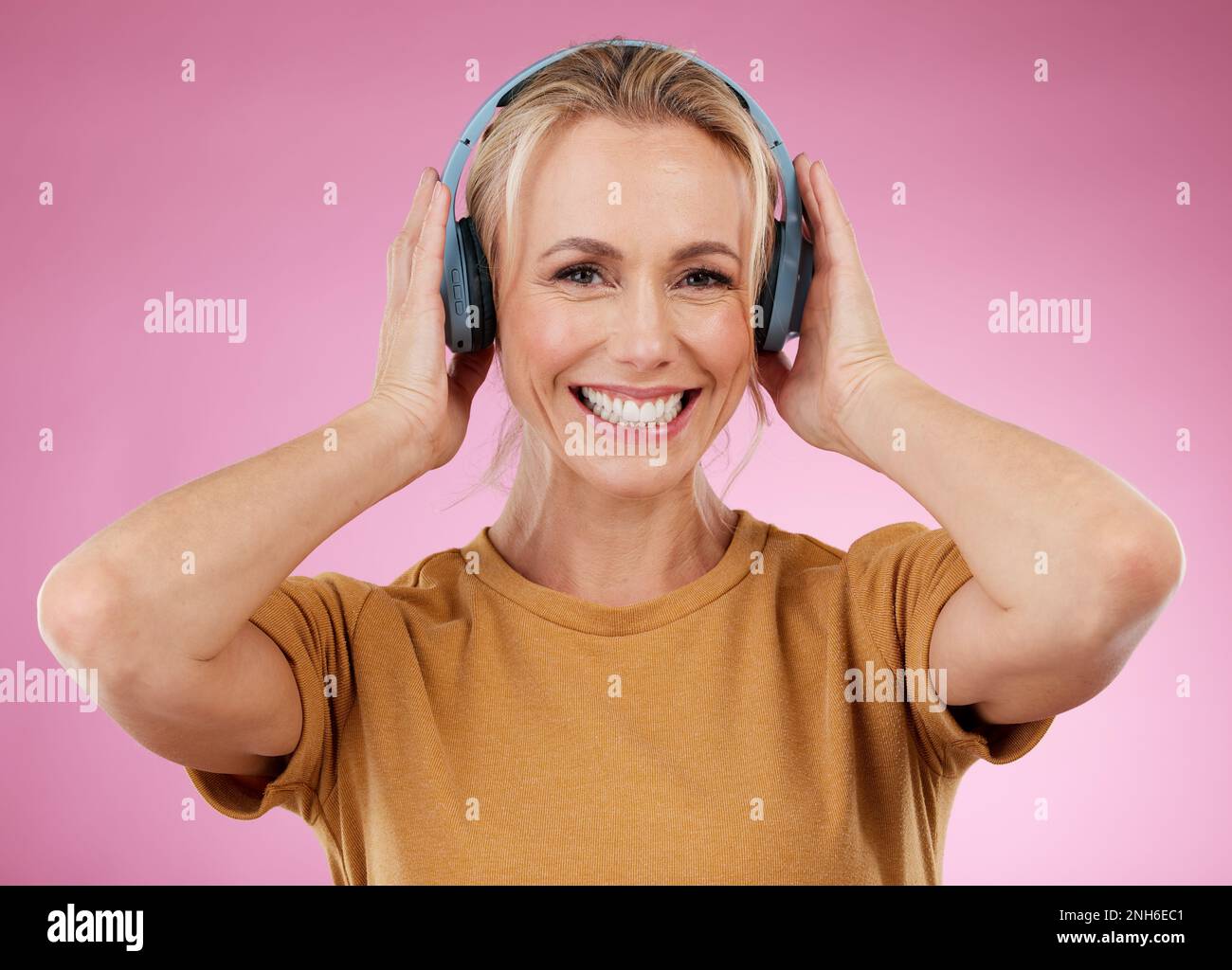 Headphones, woman and portrait on pink background, wall backdrop or ...