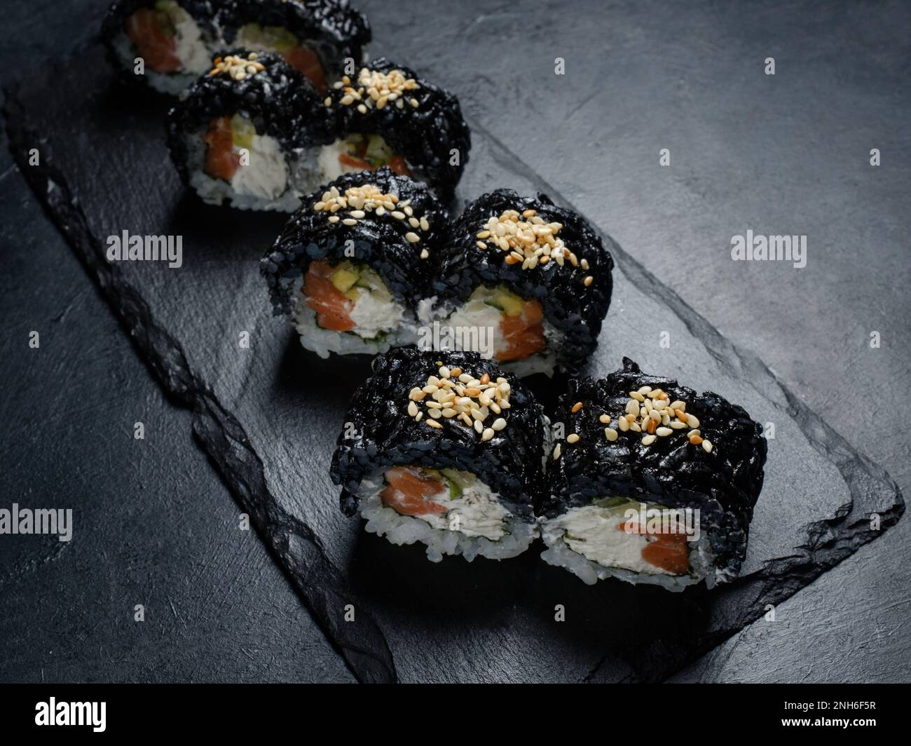 black sushi rolls eastern food restaurant meal Stock Photo - Alamy