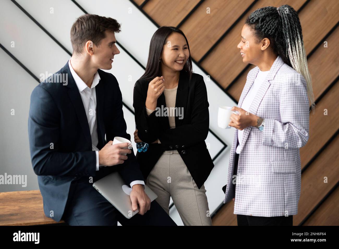 employees in the office communicate in a friendly atmosphere Stock ...