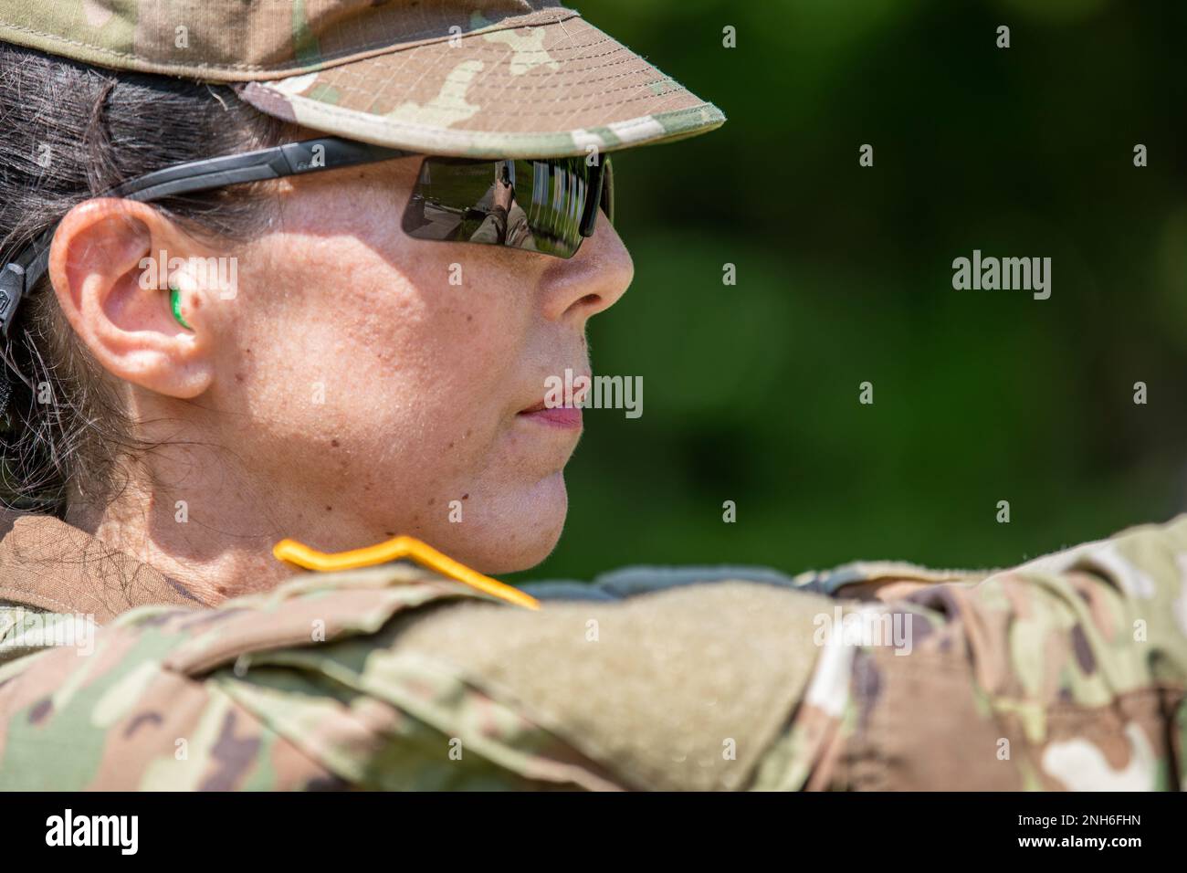 Army Reserve Capt. Joy Petway, 88th Readiness Division, eyes her target at a pistol training ...