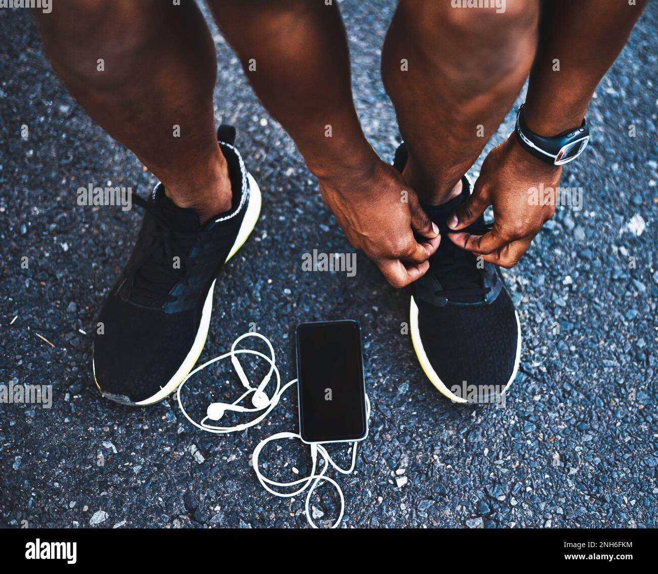 You have feet, so use it. an unrecognizable man tying his shoelaces ...