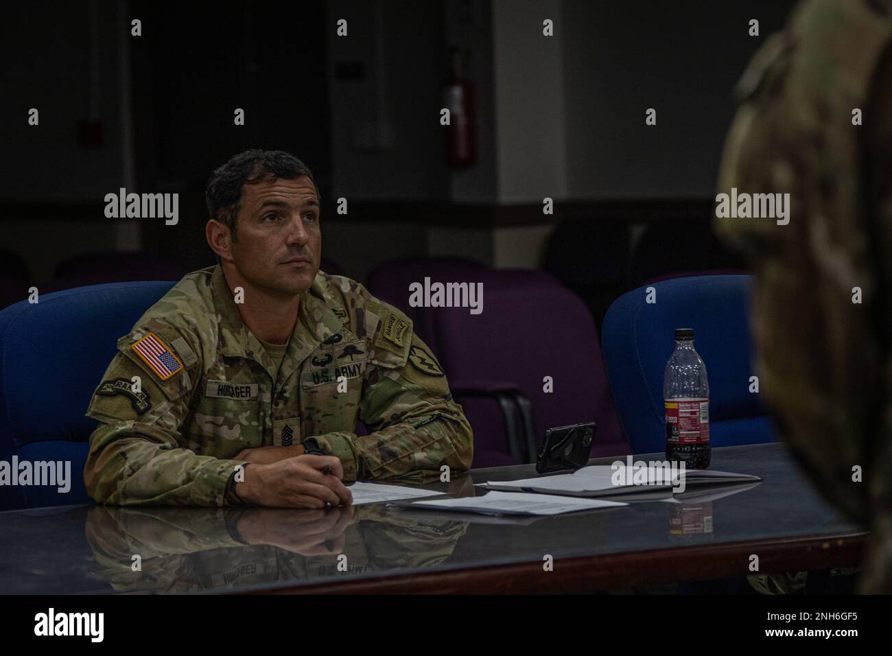 Sgt. Maj. Joshua Horsager, 25th Infantry Division, listens to the ...