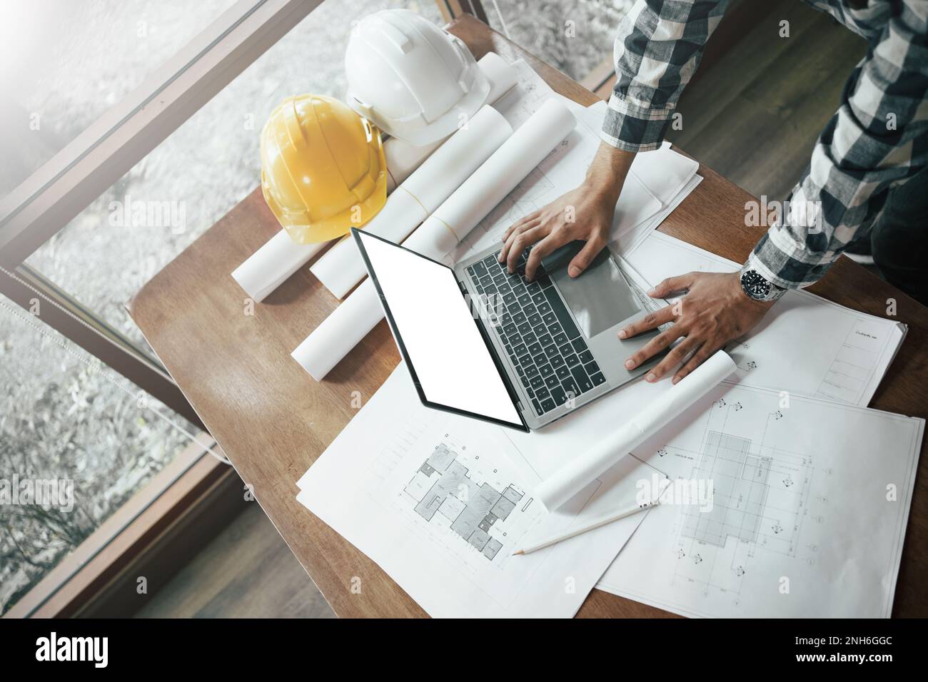 Close-up of asian male civil engineer working with drawings inspection ...